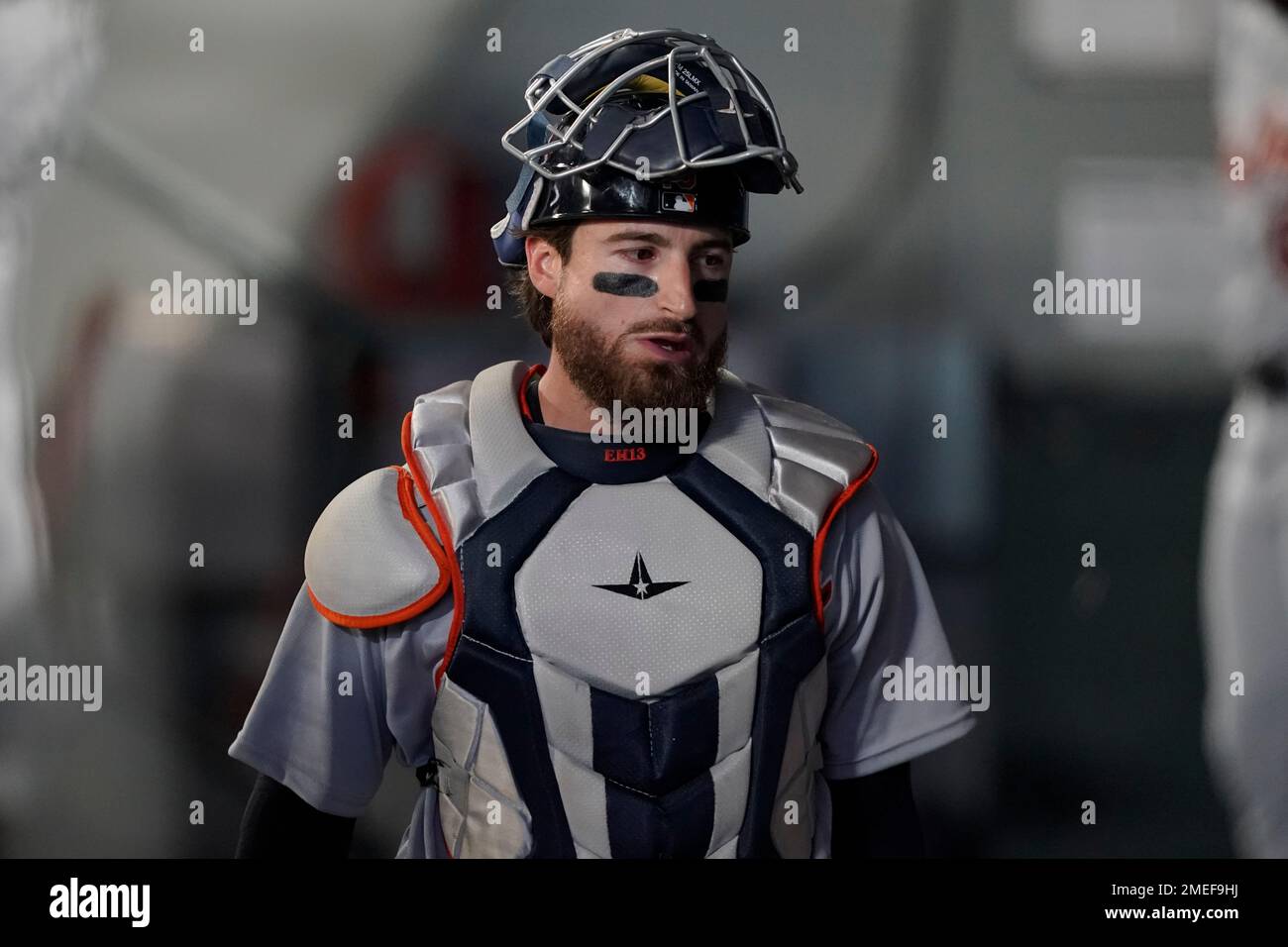 Detroit Tigers catcher Eric Haase walks in the dugout during a starting ...