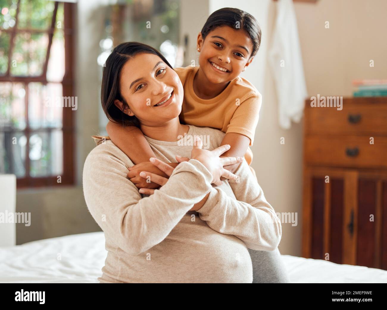 Hug, pregnant and portrait of mother and daughter in bedroom for relax ...