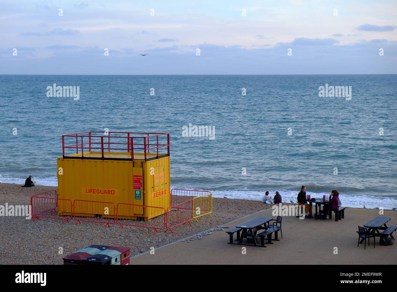 The people dining at the sandy coast in Brighton Stock Photo - Alamy