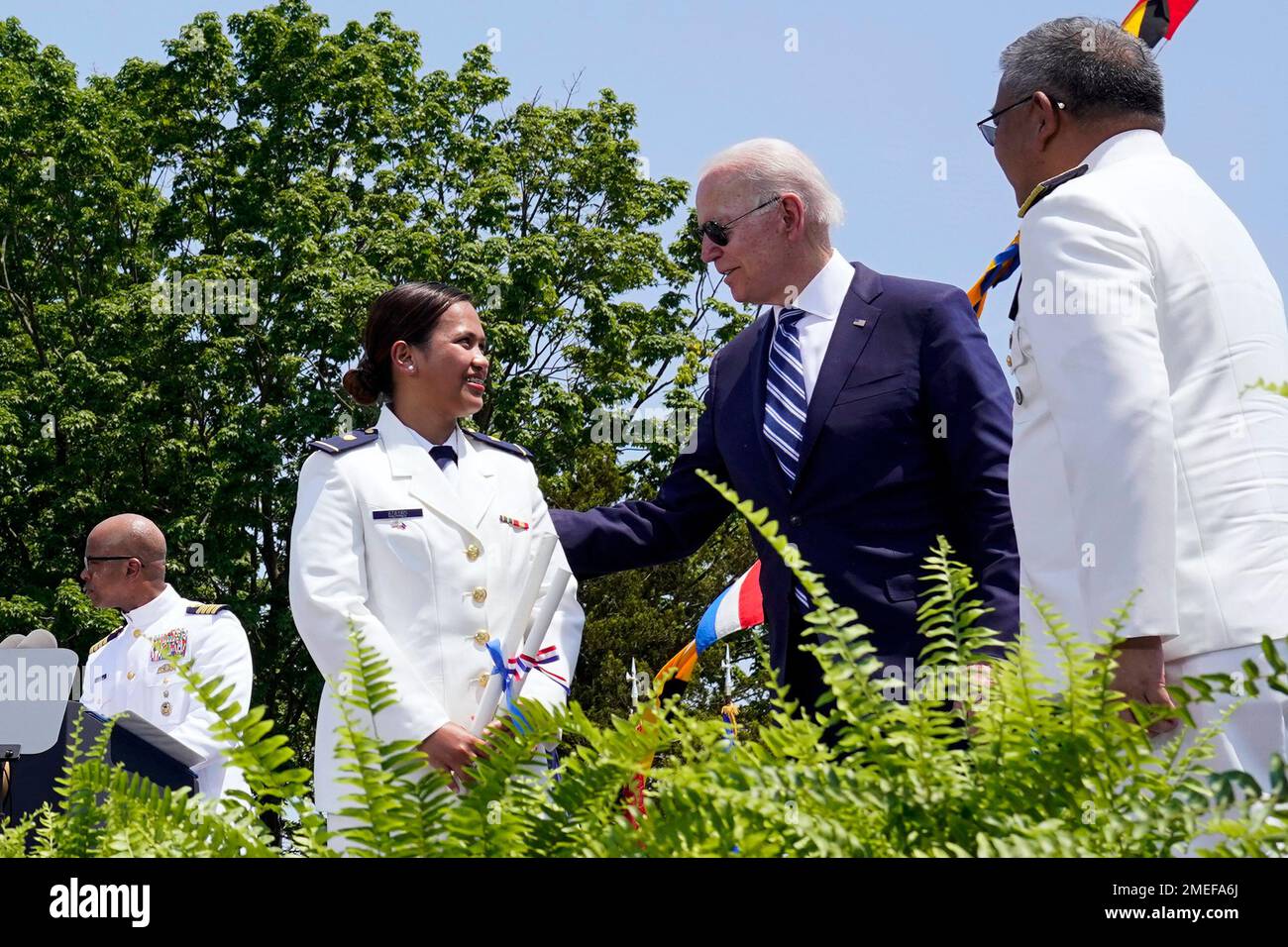 President Joe Biden congratulates Cadet Daisy Anne Atayan, one of the ...