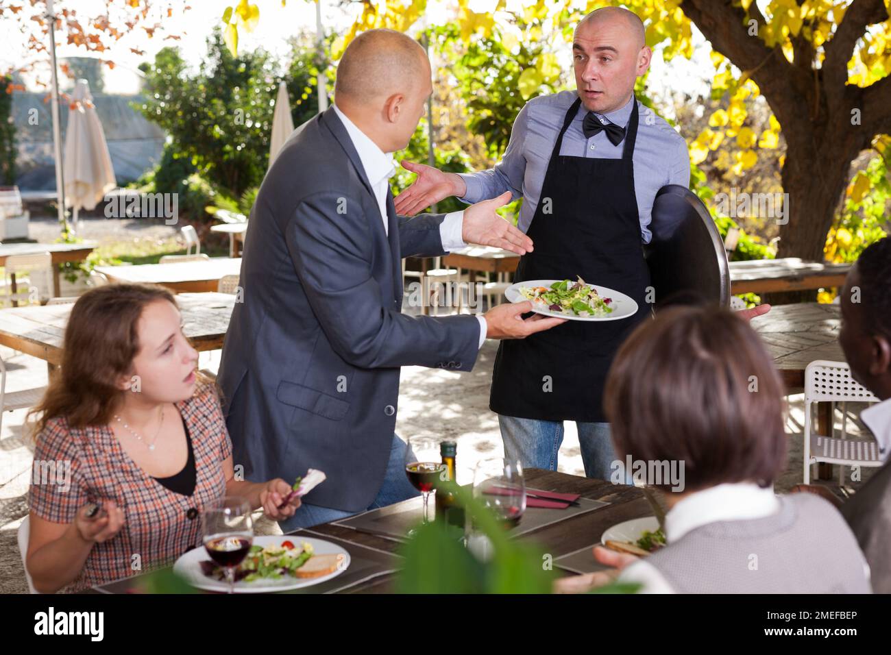 Restaurant guests complain about the food to the waiter Stock Photo - Alamy