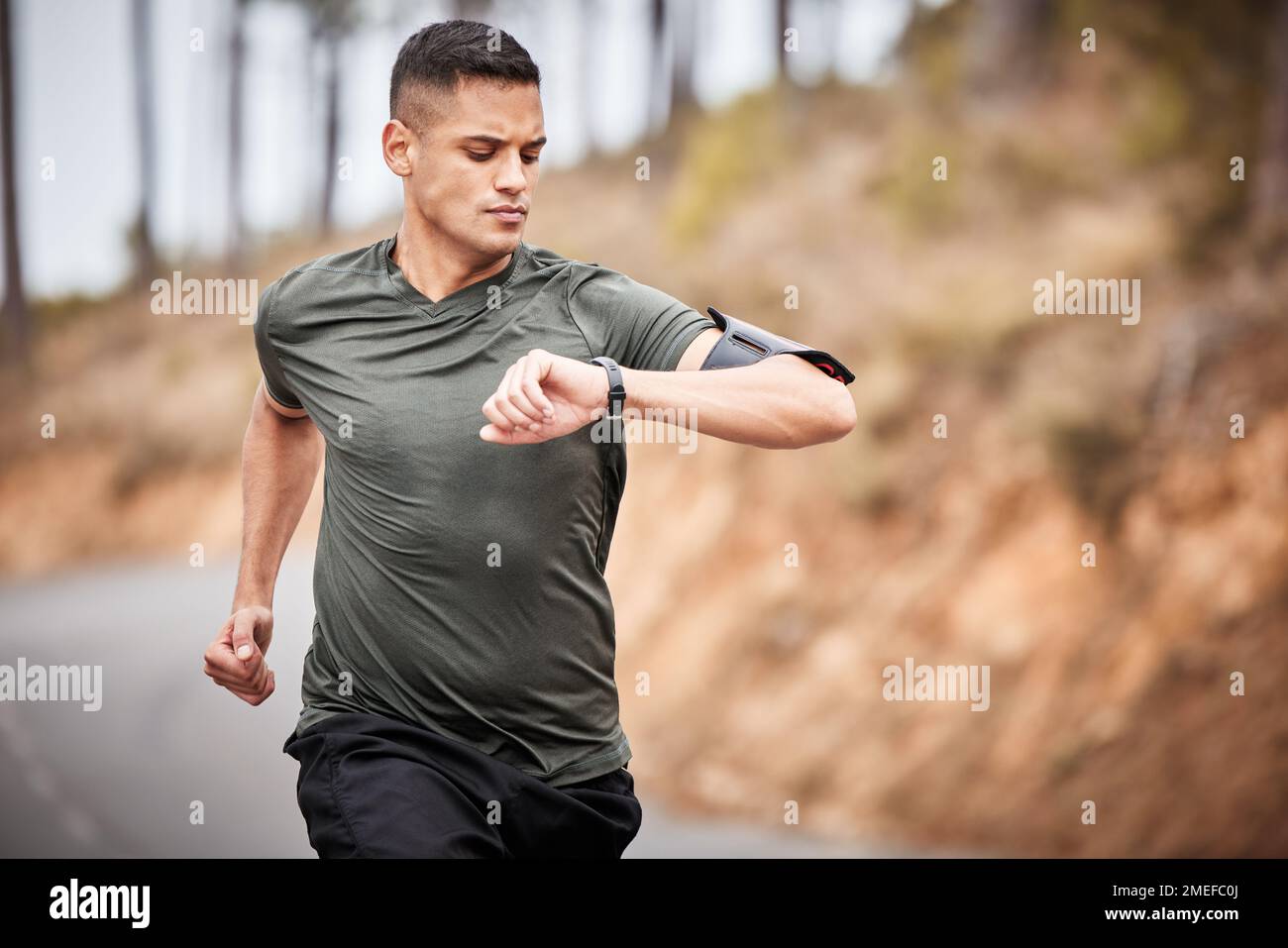 Fitness, smartwatch or man running for exercise, cardio training or ...