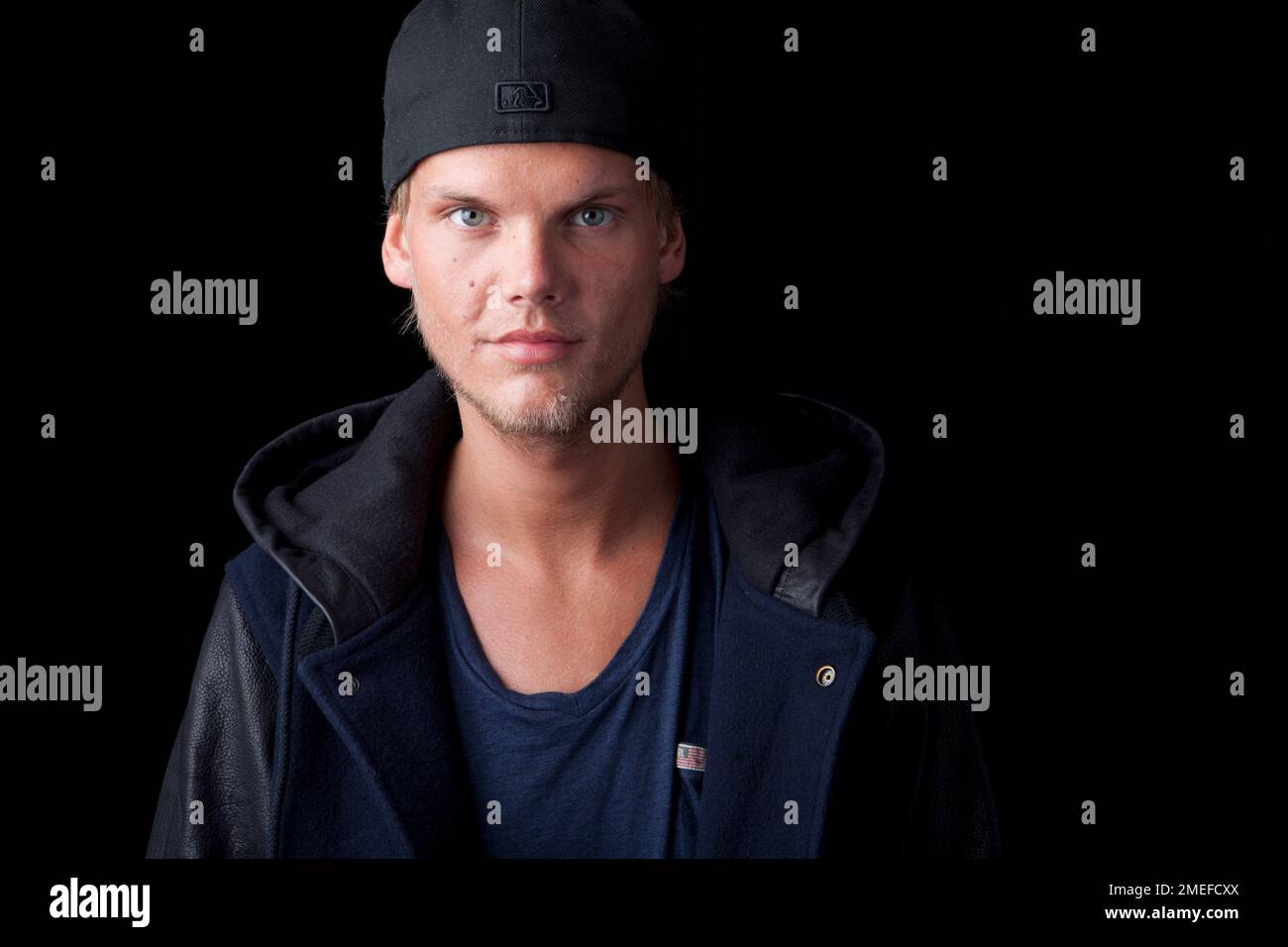 FILE - Swedish DJ, remixer and record producer Avicii poses for a ...