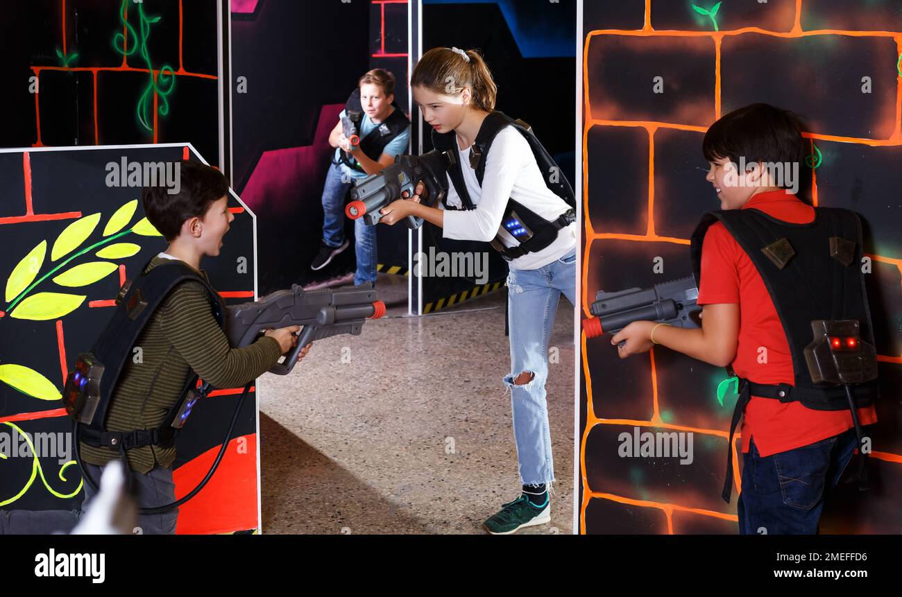 Kids playing laser tag on labyrinth Stock Photo - Alamy