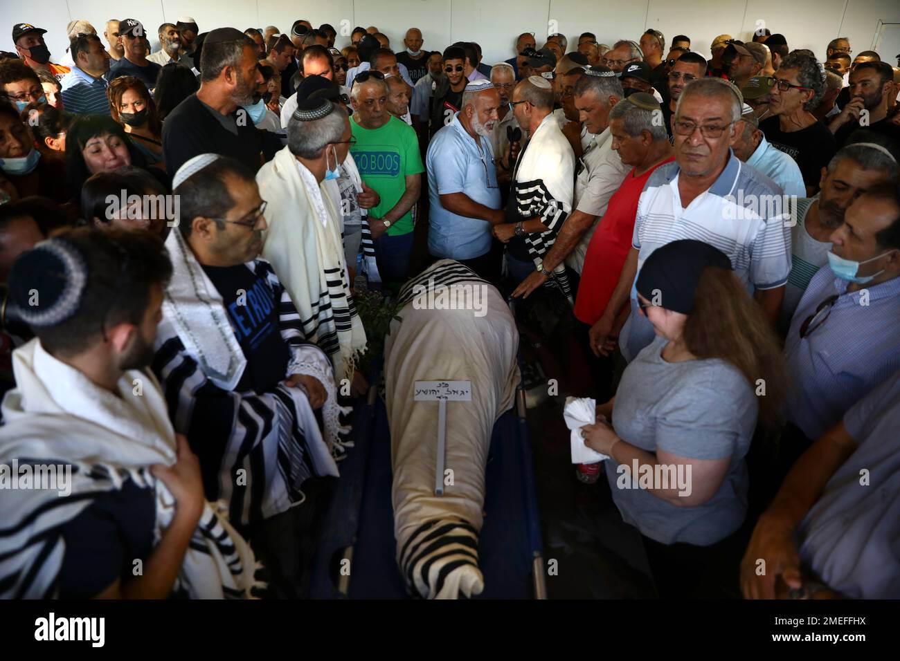 Mourners attend the funeral of Yigal Yehoshua, 56, at a cemetery in ...