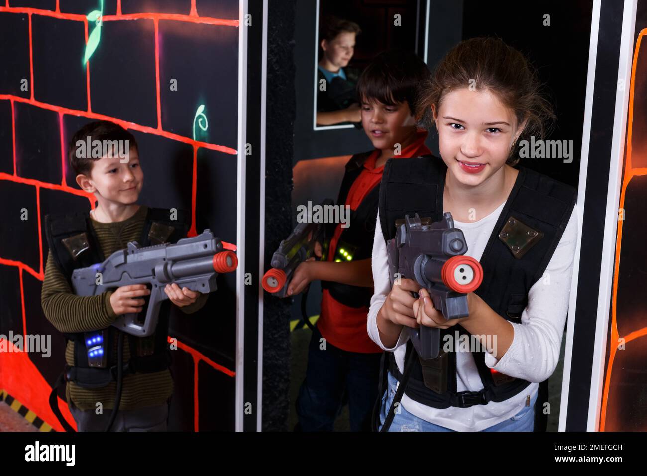 Kids playing laser tag on labyrinth Stock Photo - Alamy