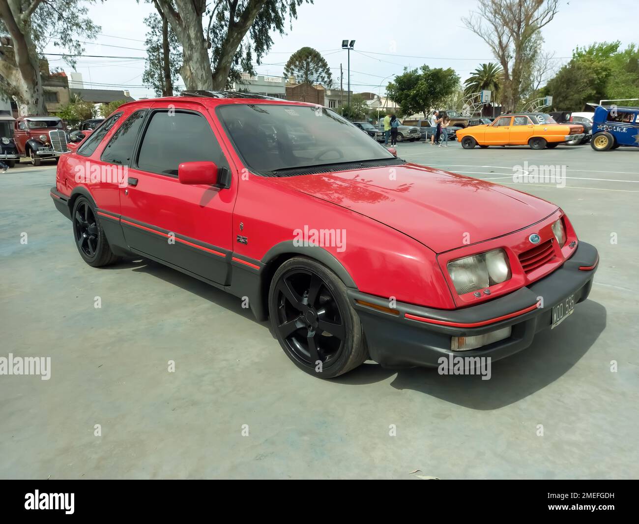 Lanus, Argentina - Sept 25, 2022: Old red 1980s Ford Sierra coupe 2.3 in a park. AAA 2022 ...
