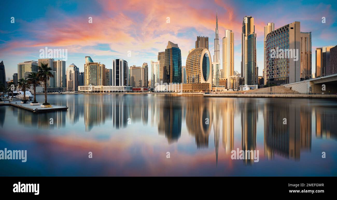 Dubai skyline with reflection at dramatic sunset, UAE Stock Photo - Alamy