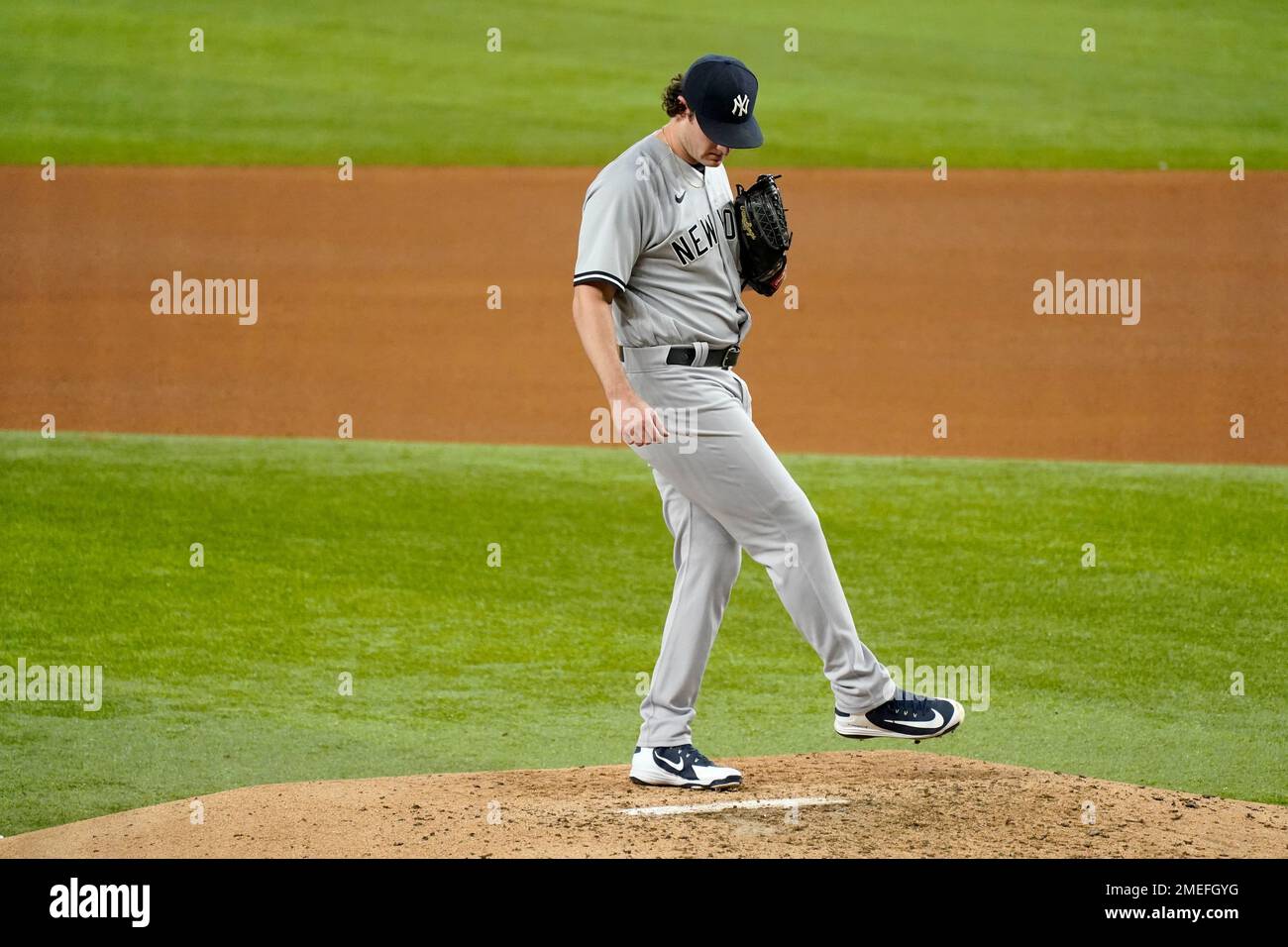 New York Yankees' Gerrit Cole kicks at the plate after giving up a home ...