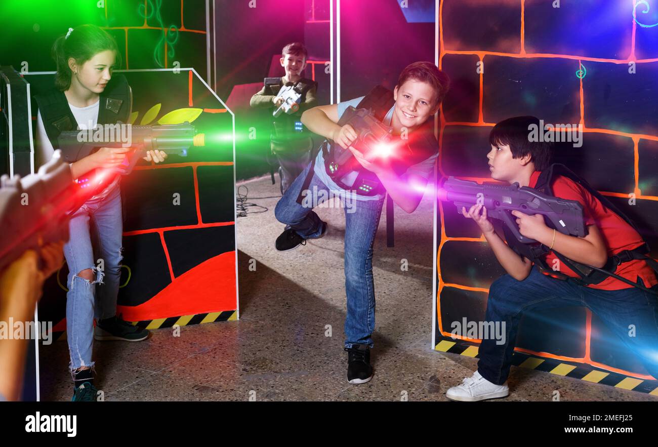 Kids playing laser tag on labyrinth Stock Photo - Alamy