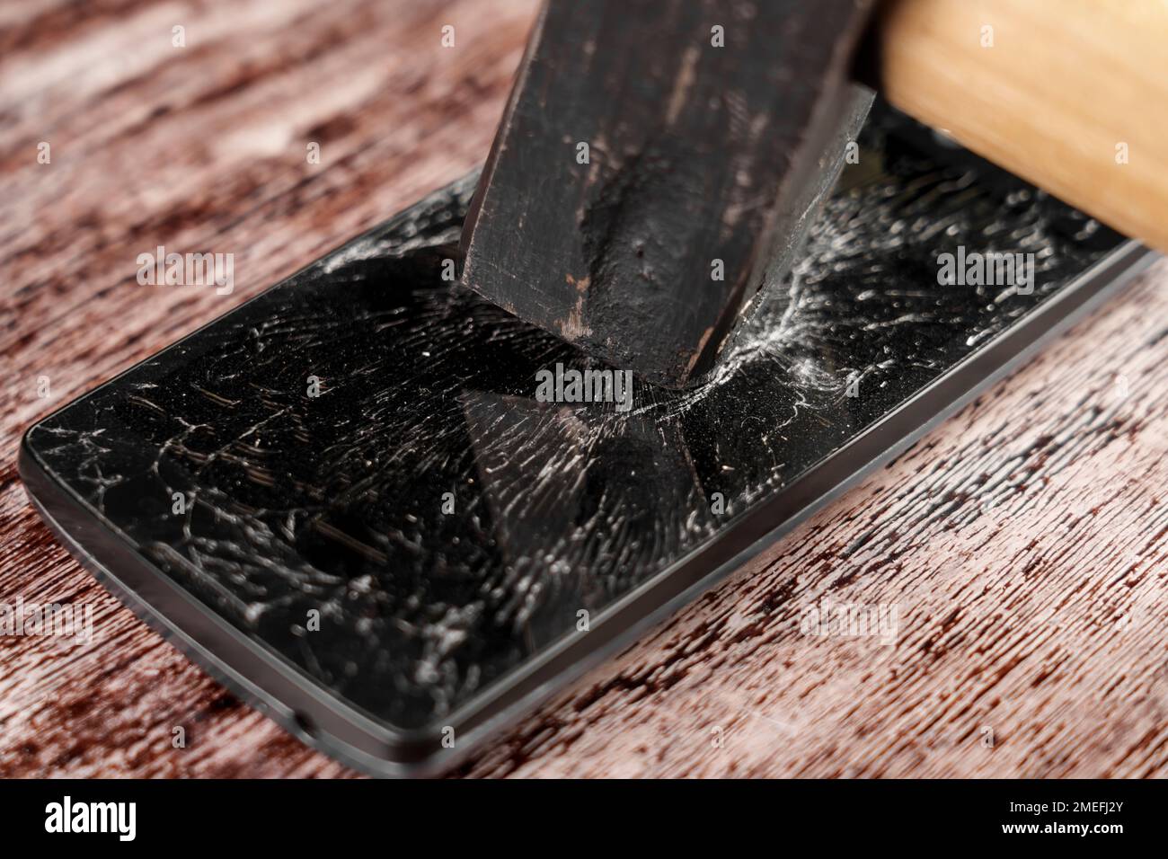 Broken smartphone with shattered cracked glass touchscreen display and ...
