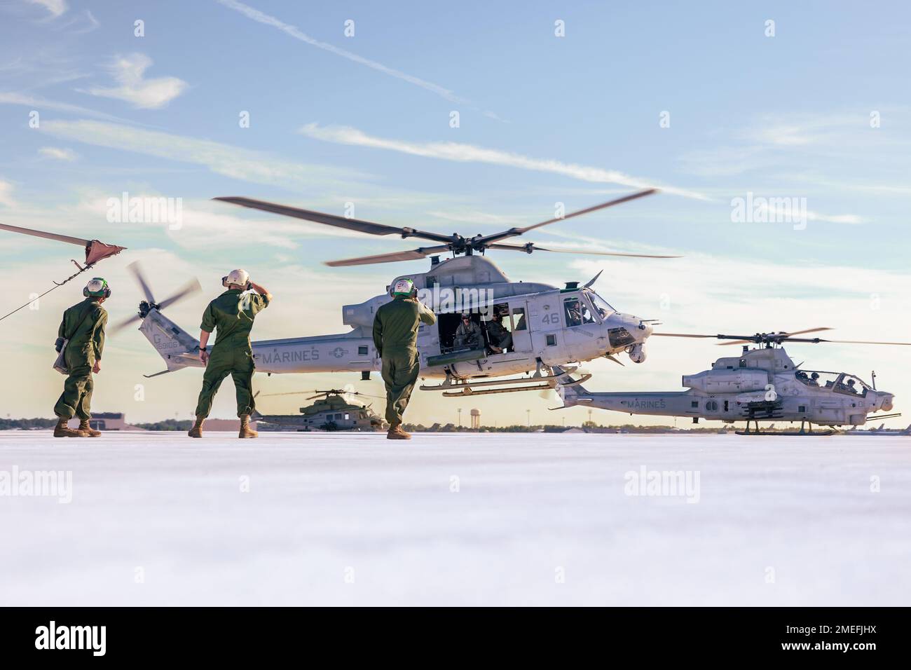 U.S. Marines with Light Attack Helicopter Squadron (HMLA) 773 observe a ...