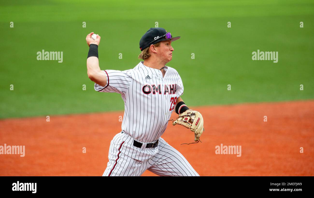 Omaha's Mike Boeve throws the ball to first base against Oral Roberts ...