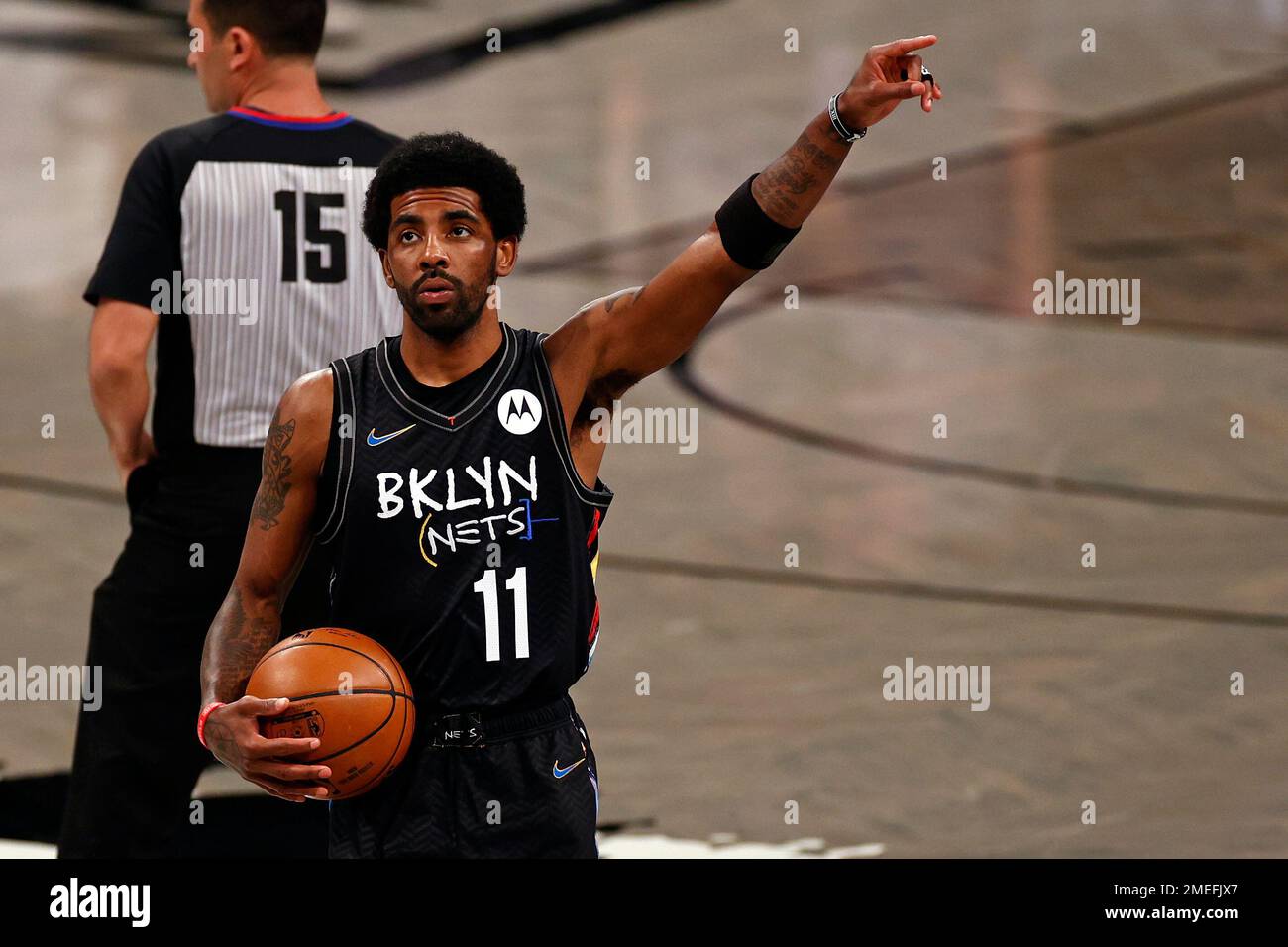 Brooklyn Nets guard Kyrie Irving (11) gestures to the crowd before ...