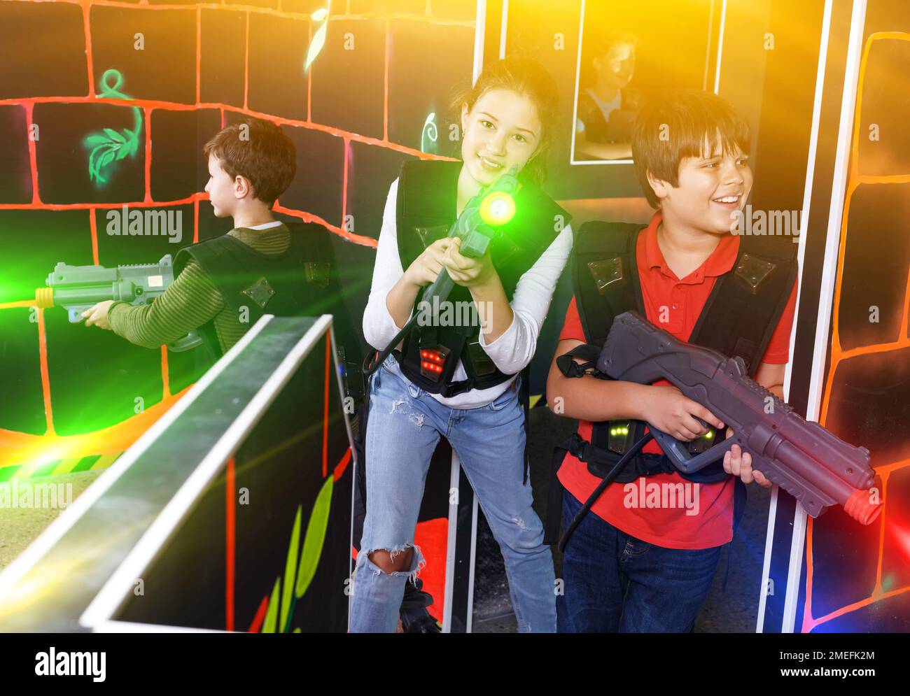 Kids playing laser tag on labyrinth Stock Photo - Alamy