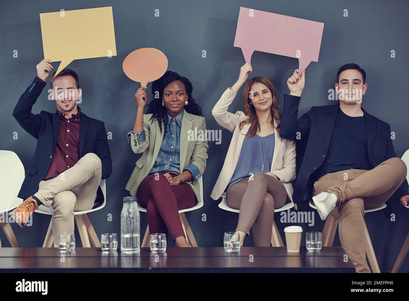 Say whatevers on your business mind. a group of businesspeople holding ...