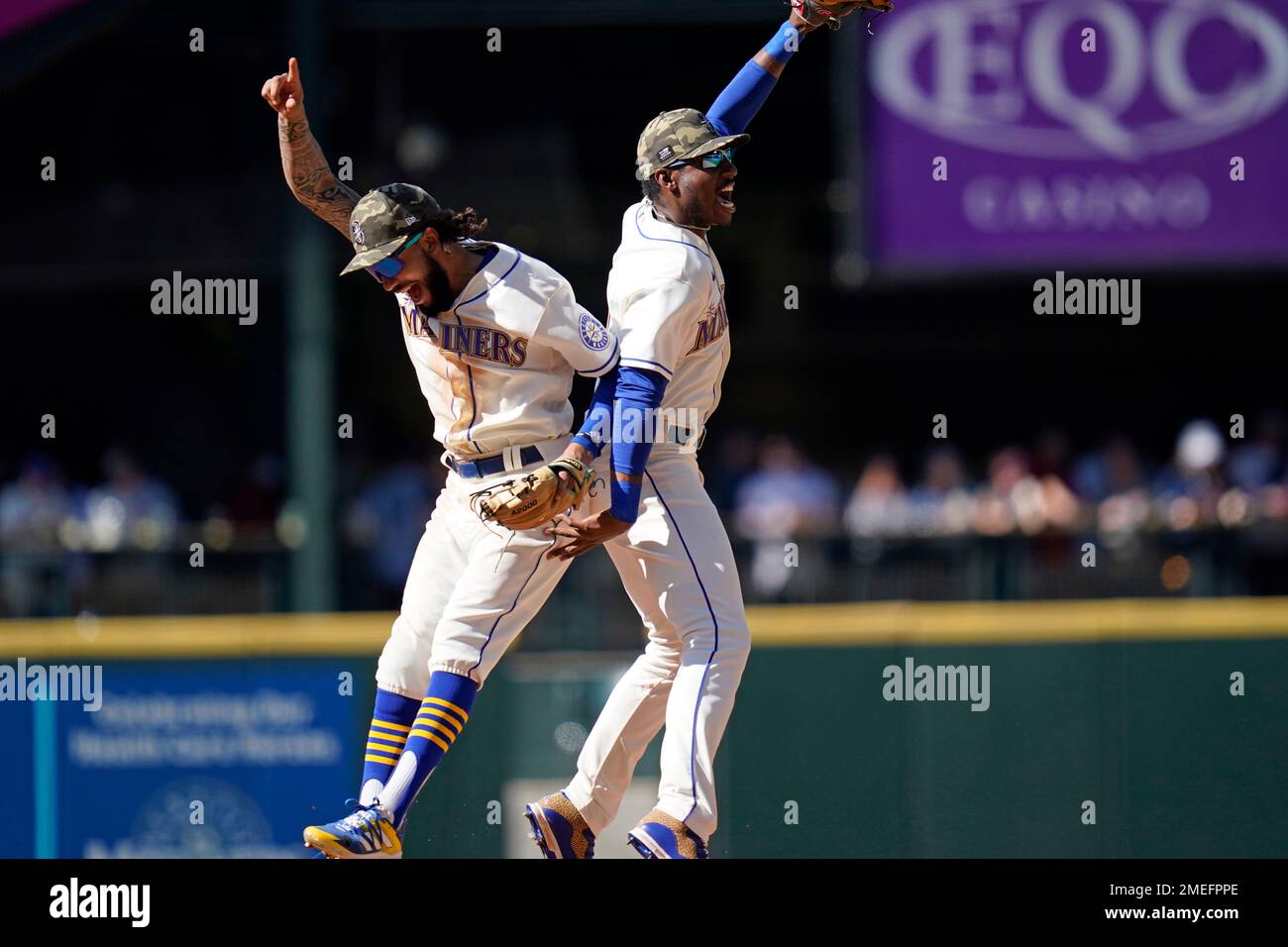 Seattle Mariners J.P. Crawford, left, and Kyle Lewis leap back-to-back ...