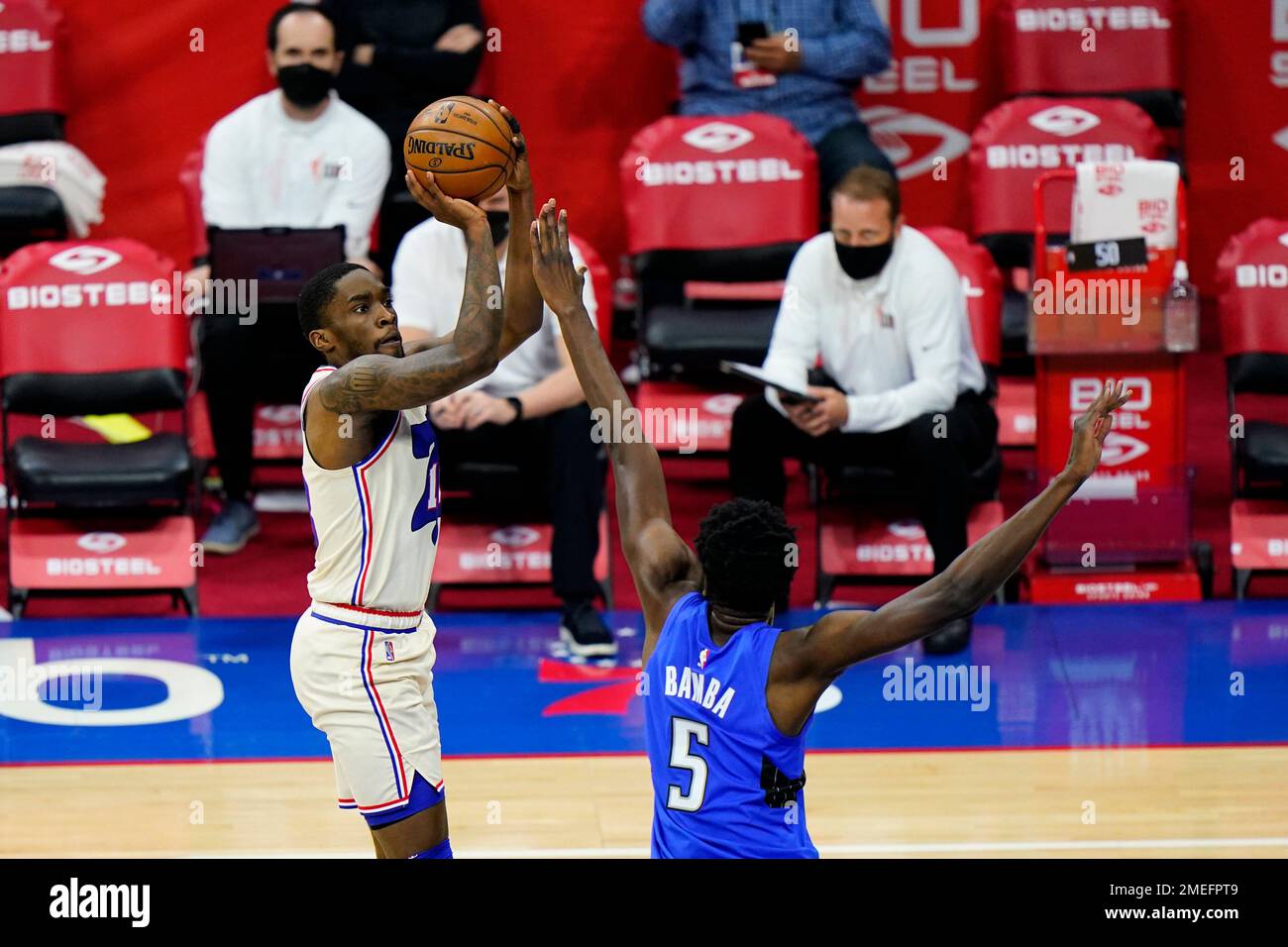 Philadelphia 76ers' Shake Milton, left, goes up for a shot against ...