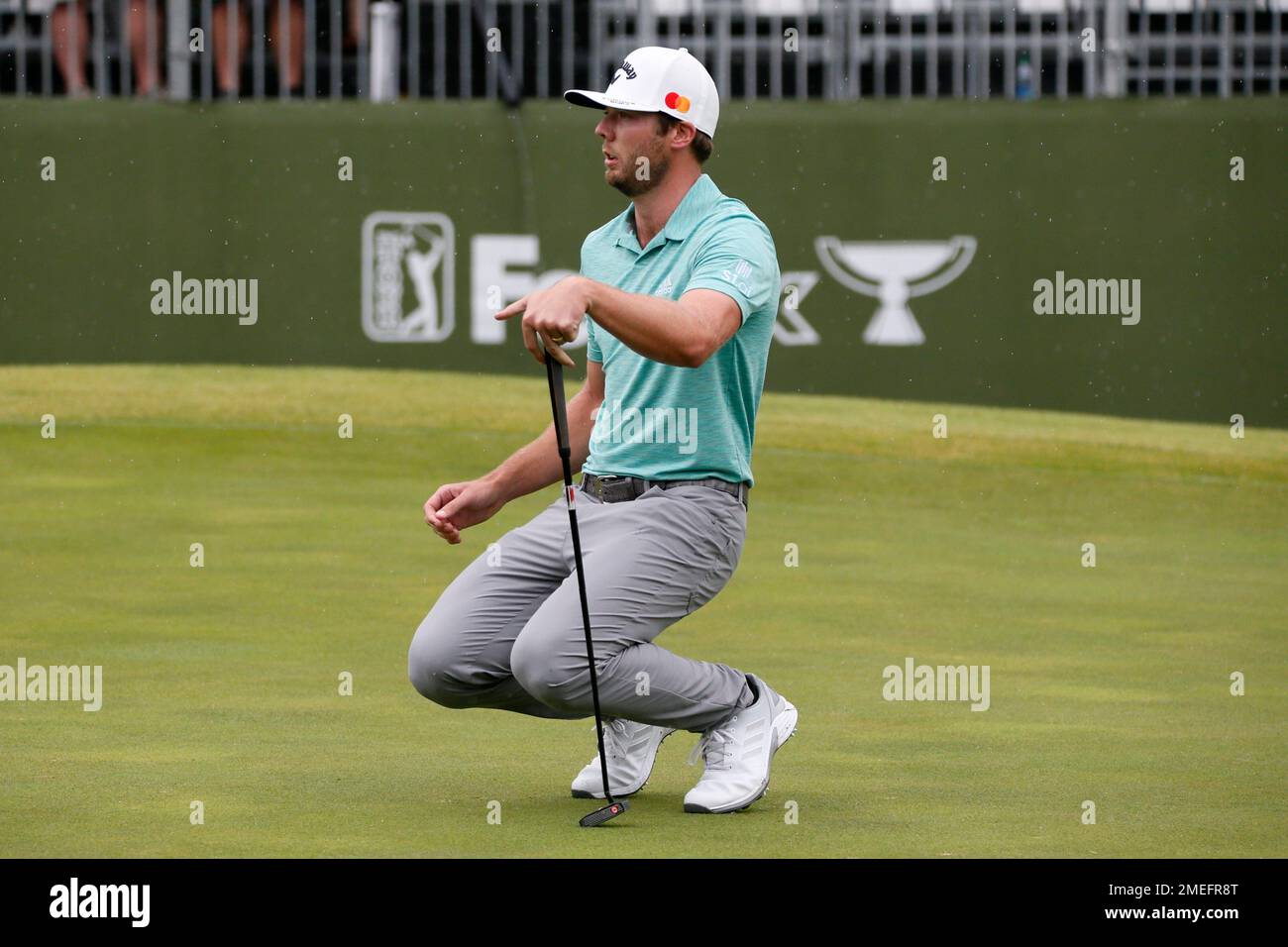 Sam Burns watches his putt on the 17th green during the final round of ...