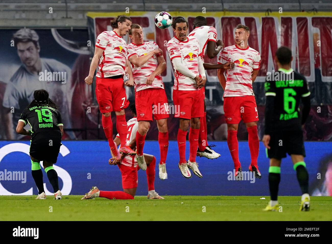 Leipzig's players jump for the ball during the Bundesliga soccer match ...