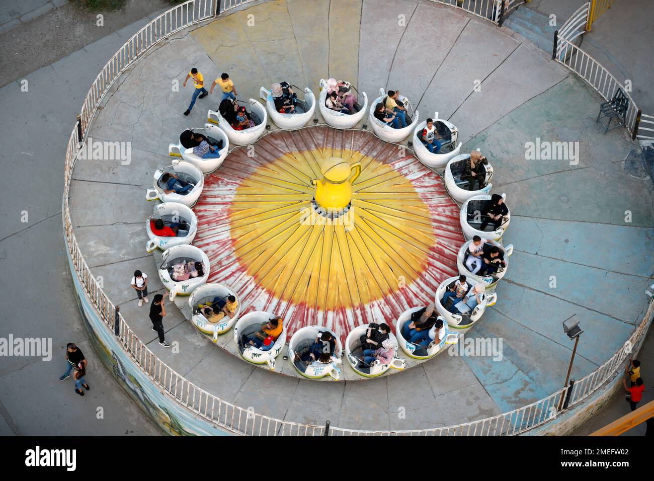 People enjoy a ride at an amusement park during Eid al- Fitr ...