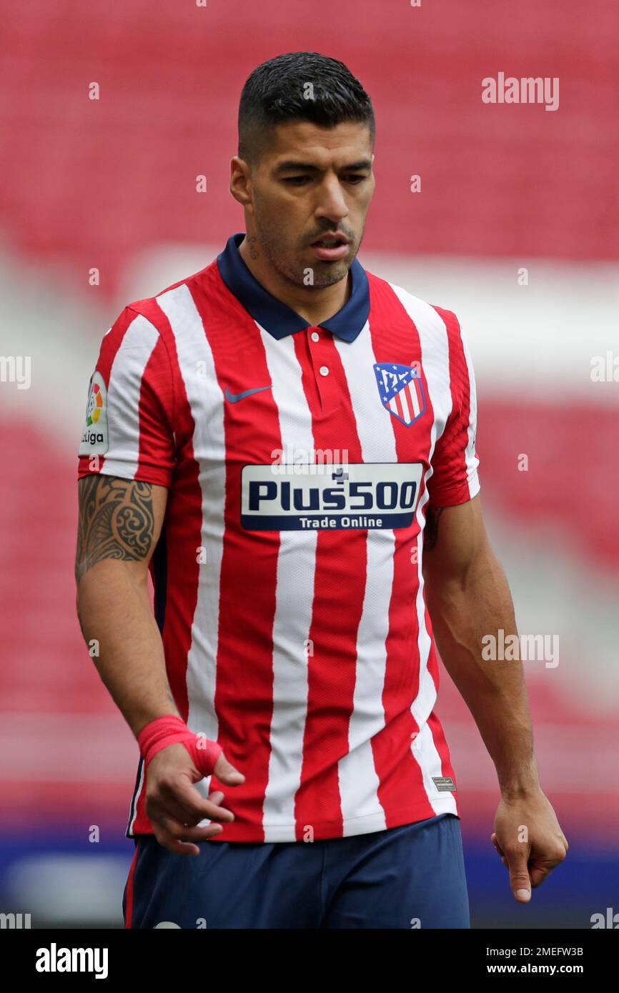 Atletico Madrid's Luis Suarez walks along the pitch during the Spanish ...