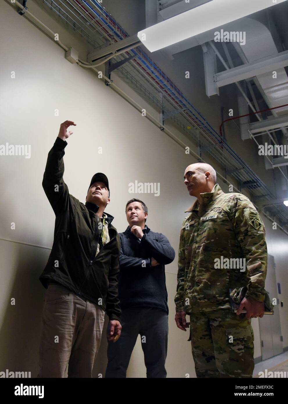 Mike Doty, electrical engineer, USACE Alaska District, points out how ...