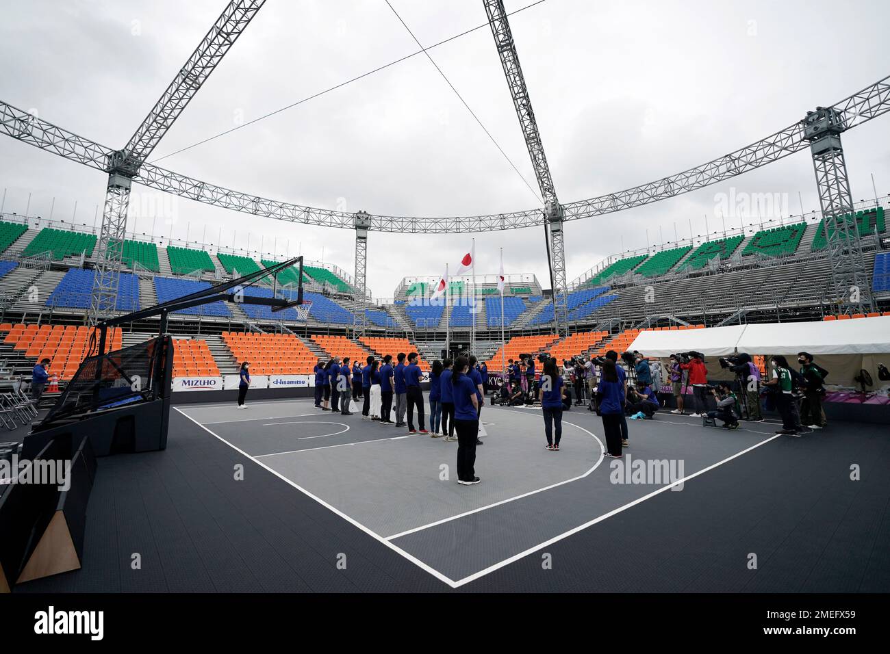 Staff members act as medalists for a demo rehearsal exercise during the ...