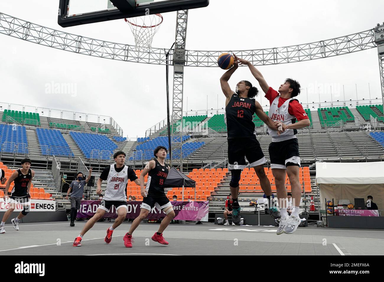 Athletes compete during the Tokyo 2020 Olympic Game men's basketball ...