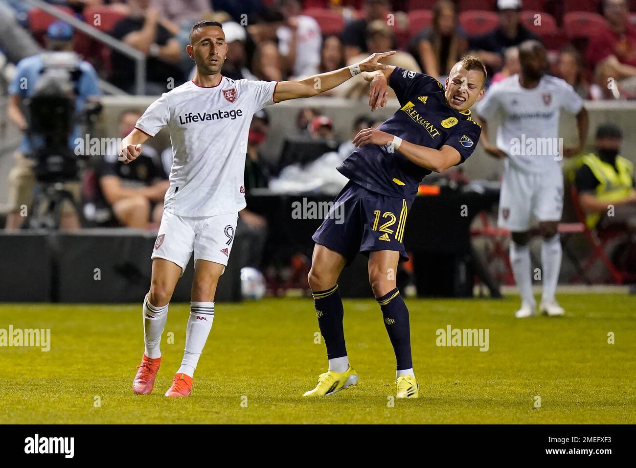 Real Salt Lake forward Justin Meram (9) pushes Nashville SC defender ...