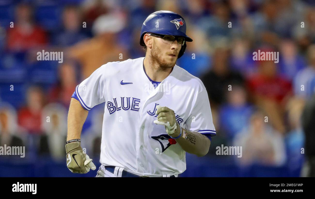 Toronto Blue Jays' Danny Jansen runs to first base as he flies out ...