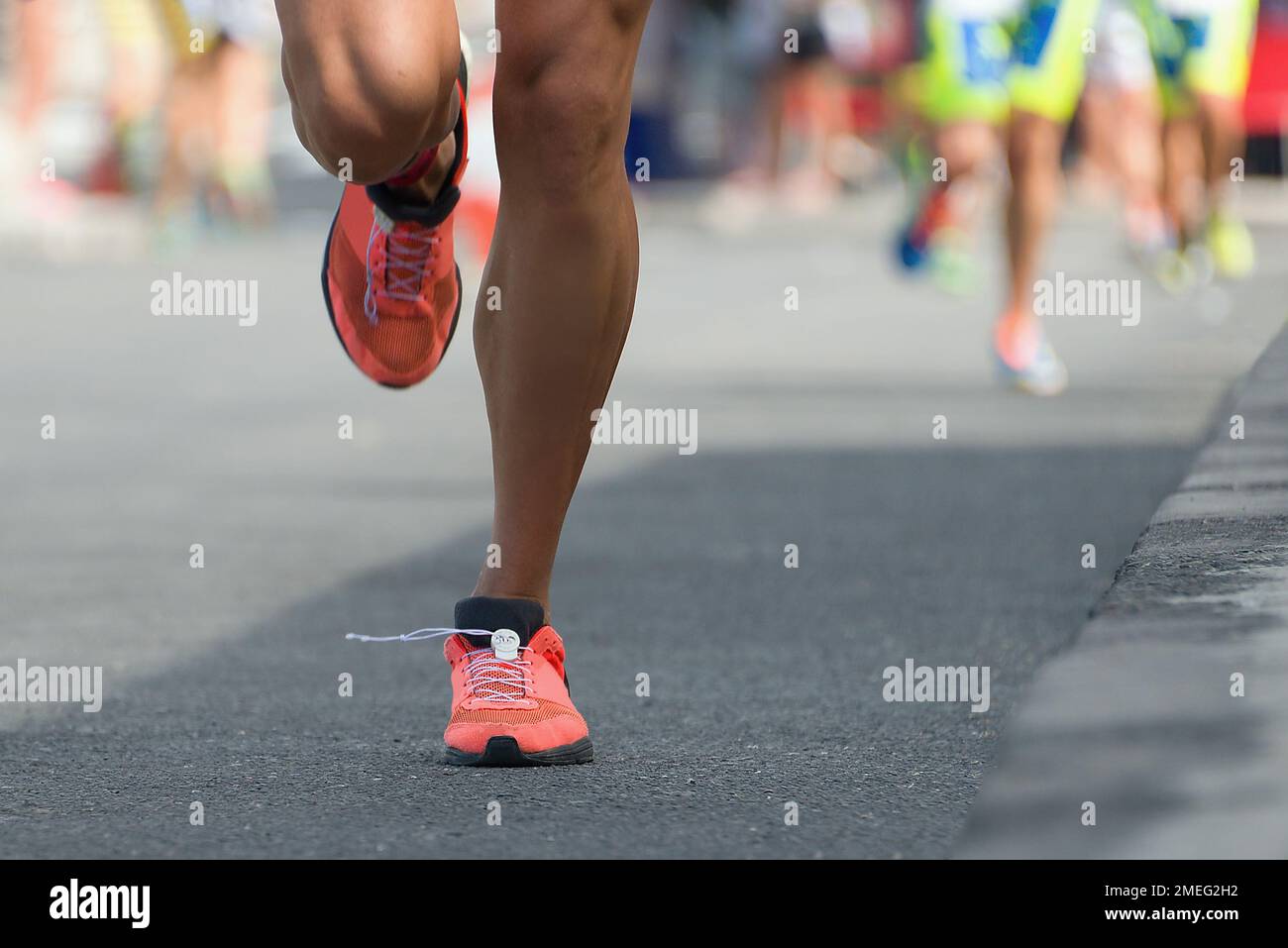 People running fast in a city marathon on street Stock Photo - Alamy