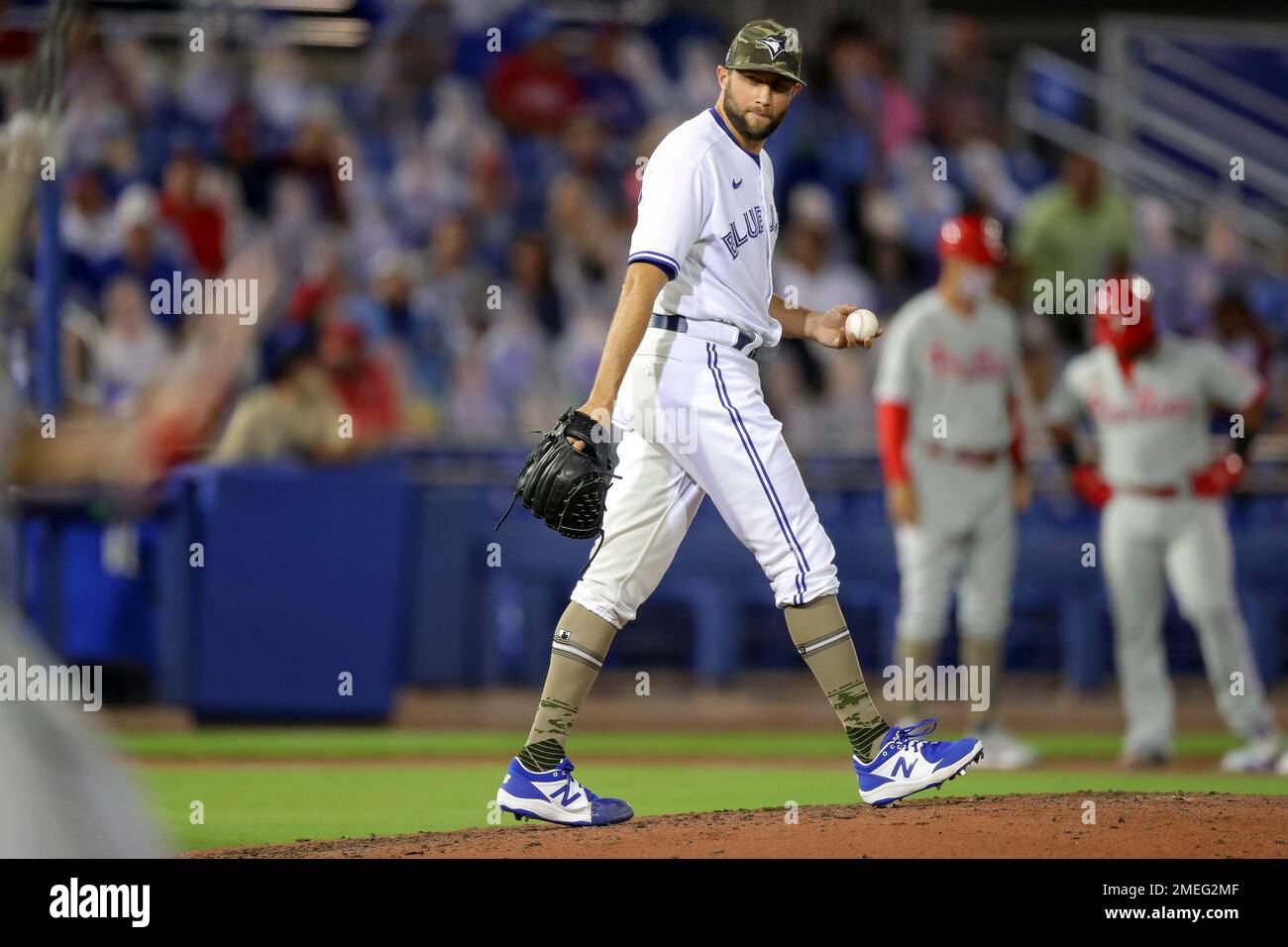 Toronto Blue Jays relief pitcher Tim Mayza reacts after giving up a run ...
