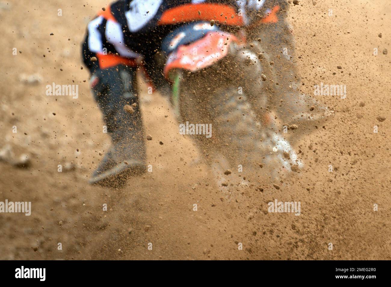 Flying debris from a motocross in dirt track Stock Photo - Alamy