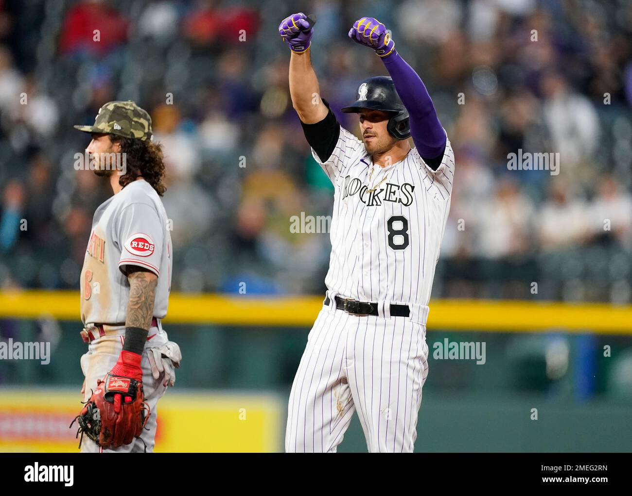Colorado Rockies' Josh Fuentes (8) gestures toward the dugout after ...