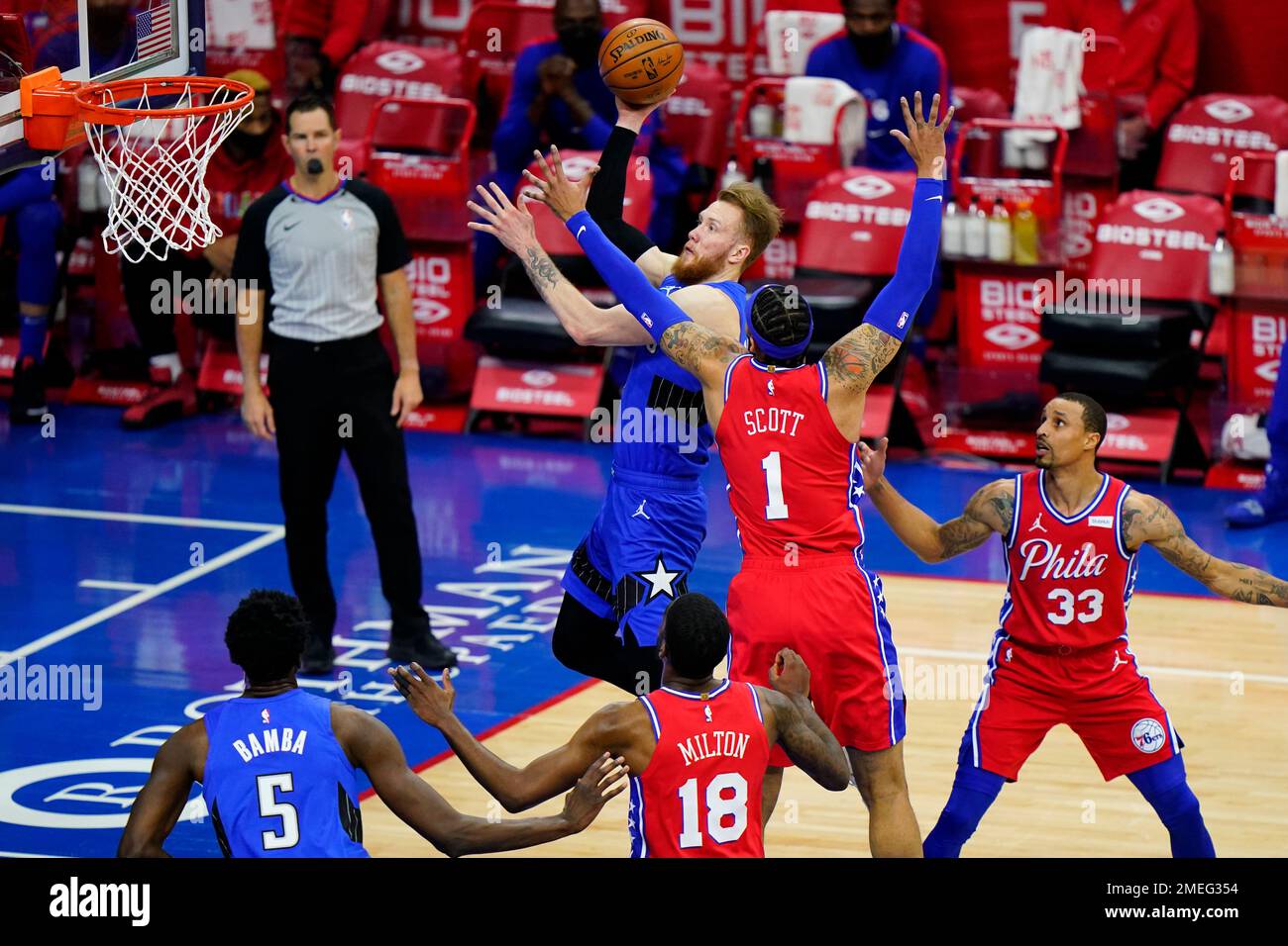 Orlando Magic's Ignas Brazdeikis, left, goes up for a shot past ...