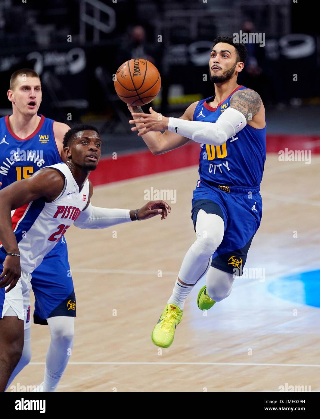 Denver Nuggets guard Markus Howard (00) makes a layup next to Detroit ...