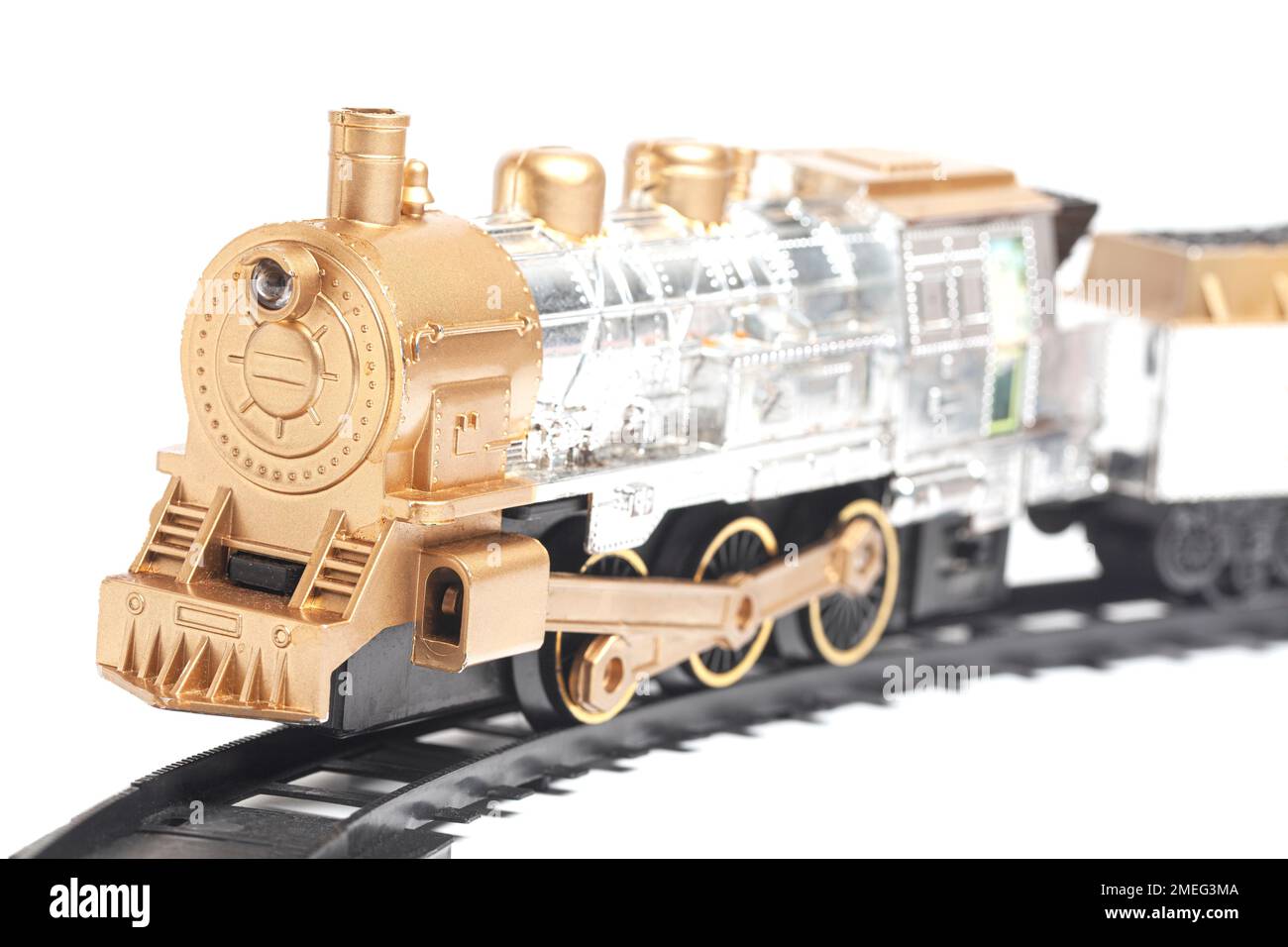 toy train with freight car trolley on railway tracks, isolated on white ...