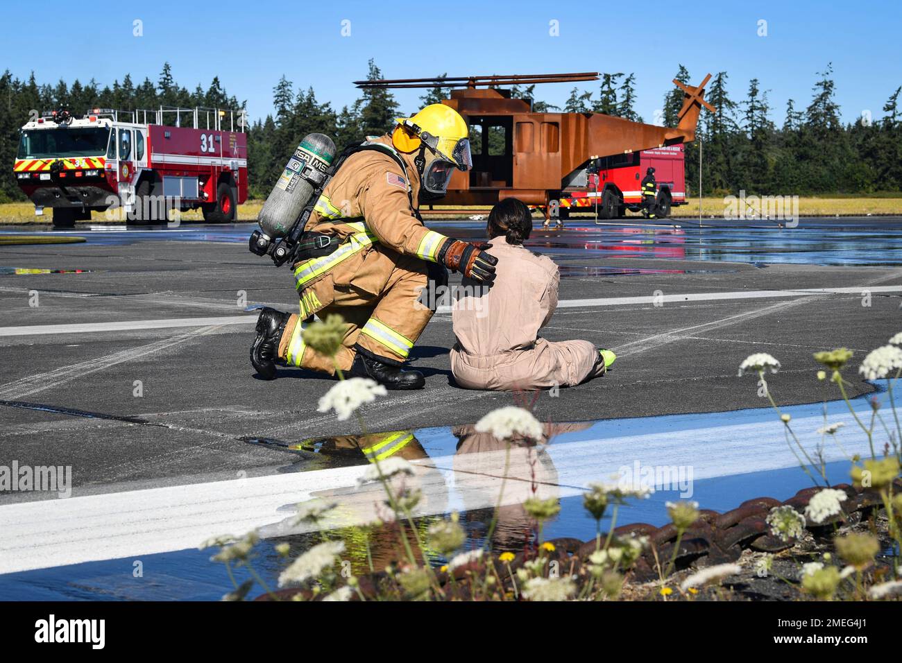 A firefighter assigned to Navy Region Northwest Fire and Emergency ...