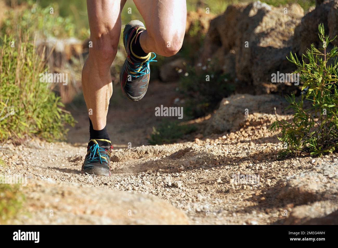 Trail running man on mountain path exercising Stock Photo - Alamy