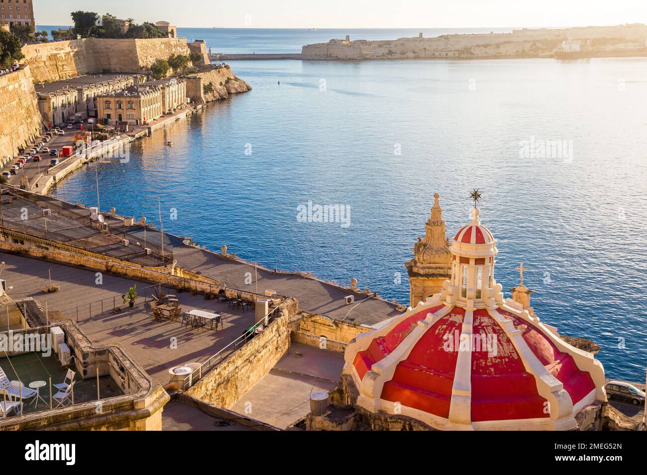 Valletta, Malta - The old harbor of Valletta with red painted church ...