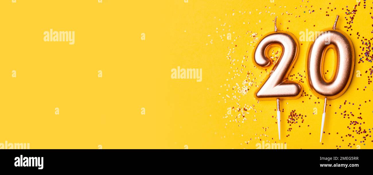 Gold candles in the form of number twenty Stock Photo - Alamy