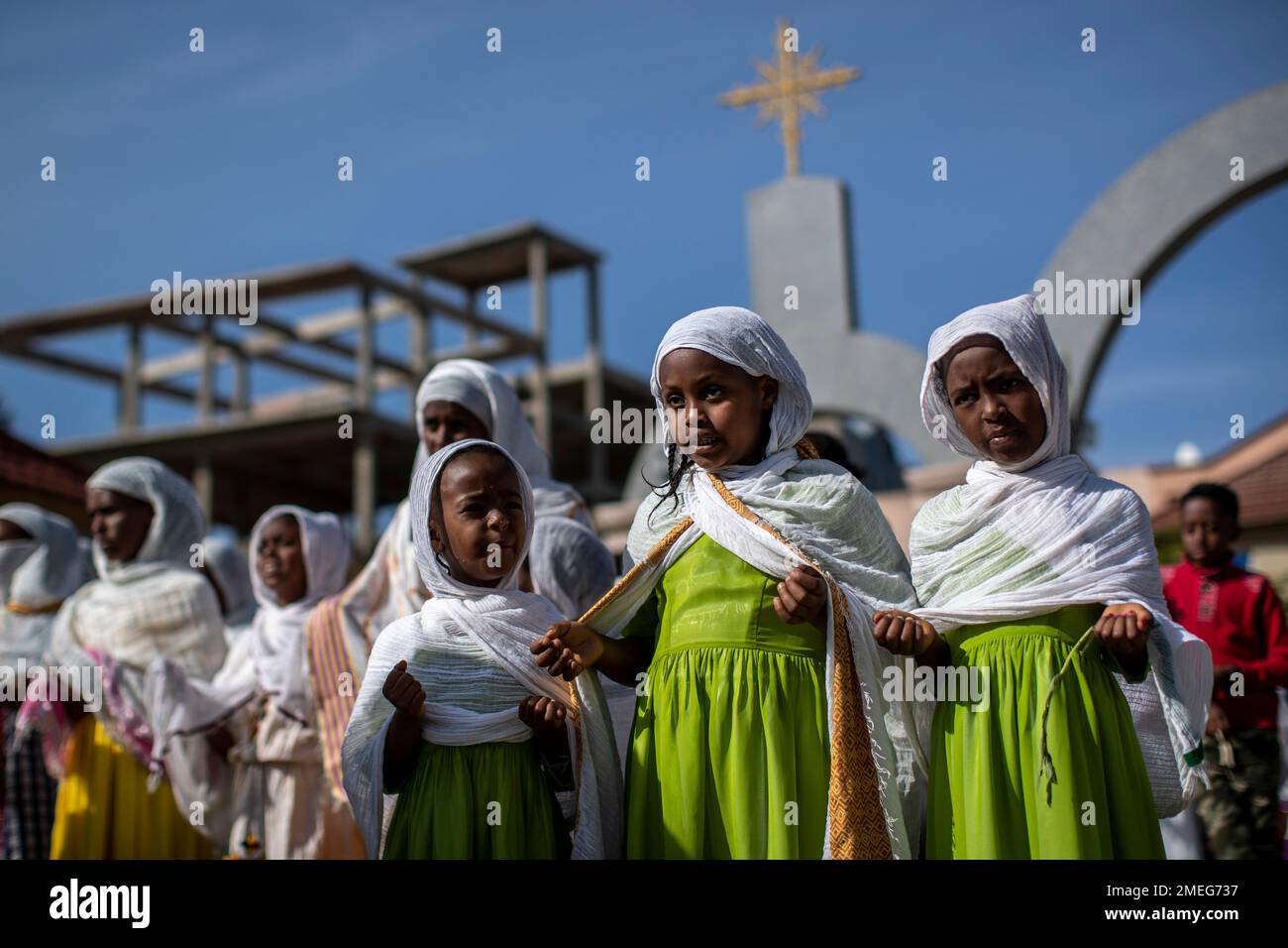 Children and other congregants pray during a Sunday morning service of ...
