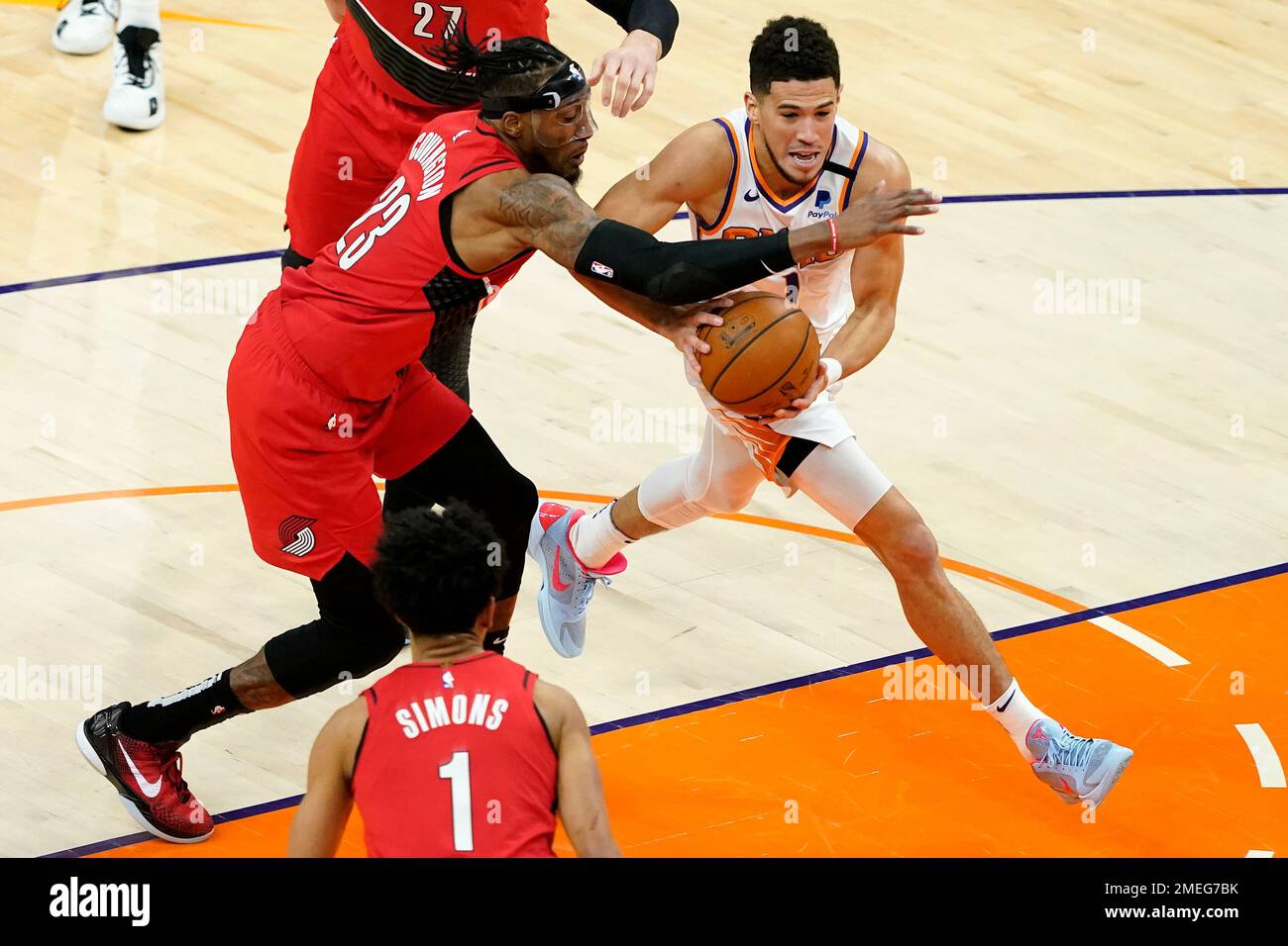 Phoenix Suns guard Devin Booker drives on Portland Trail Blazers ...