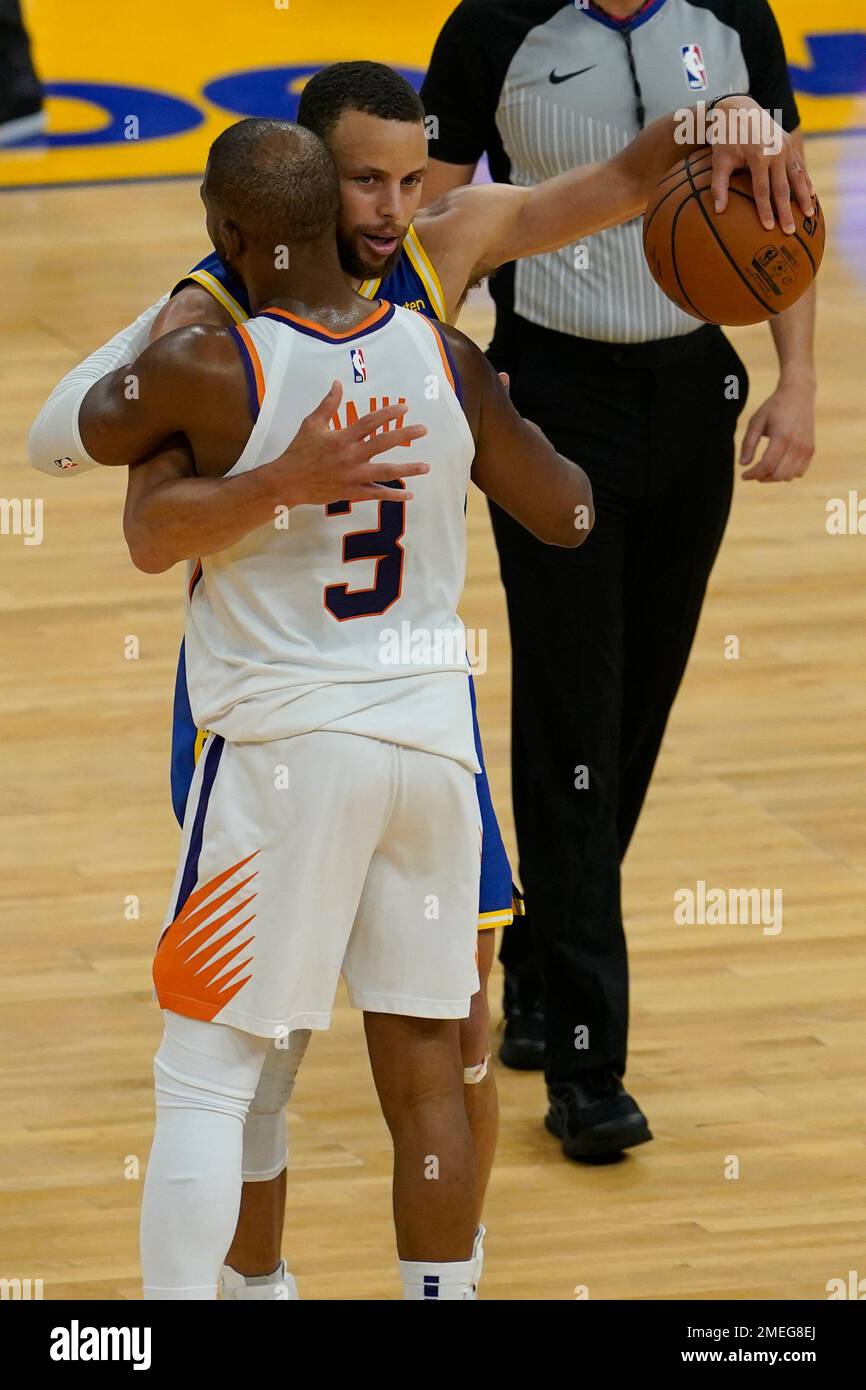 Phoenix Suns guard Chris Paul (3) hugs Golden State Warriors guard ...