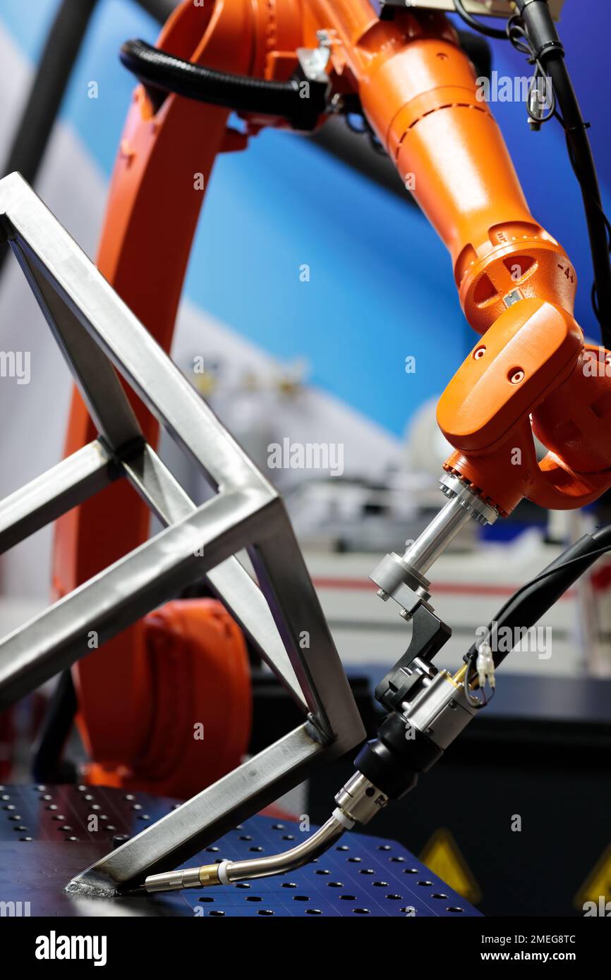 6 axis industrial welding system with robotic arm. Selective focus ...