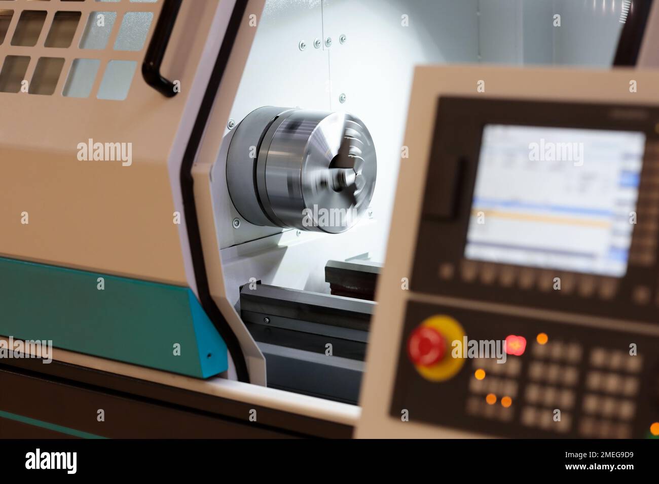 CNC lathe turning machine with spinning spindle. Selective focus Stock ...