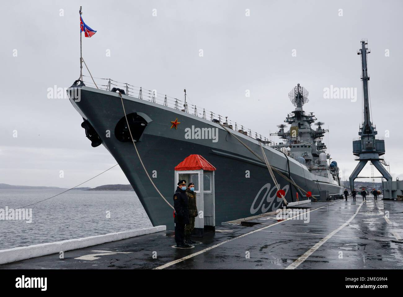 Russian sailors stand guard at the Northern Fleet's flagship, the Pyotr ...