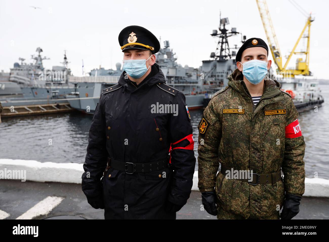 Russian sailors stand guard near the Northern Fleet's flagship, the ...
