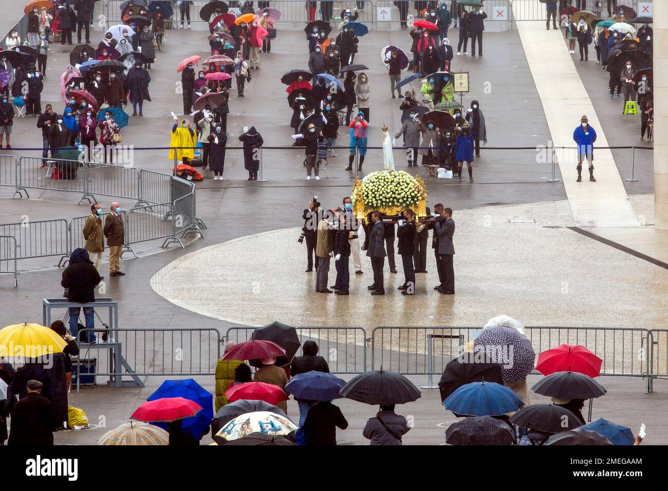 Worshippers wave handkerchiefs in farewell to the statue of Our Lady of ...